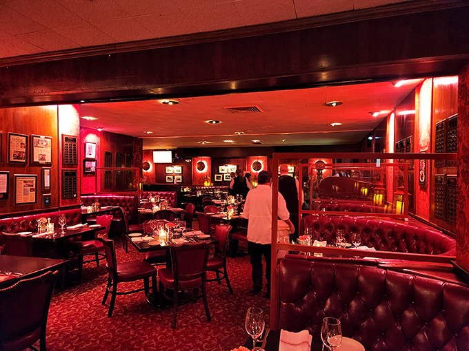 The dining room glows with that signature red that makes everyone look 10 years younger and 30% more interesting.