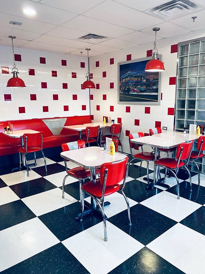 Red booths against checkerboard floors&mdash;this isn't just a dining room, it's a movie set where your life suddenly feels more cinematic.