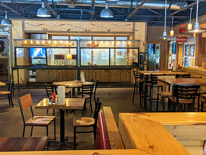 The wooden tables and industrial ceiling aren't just design choices—they're setting the stage for the meat-centric drama about to unfold on your plate.