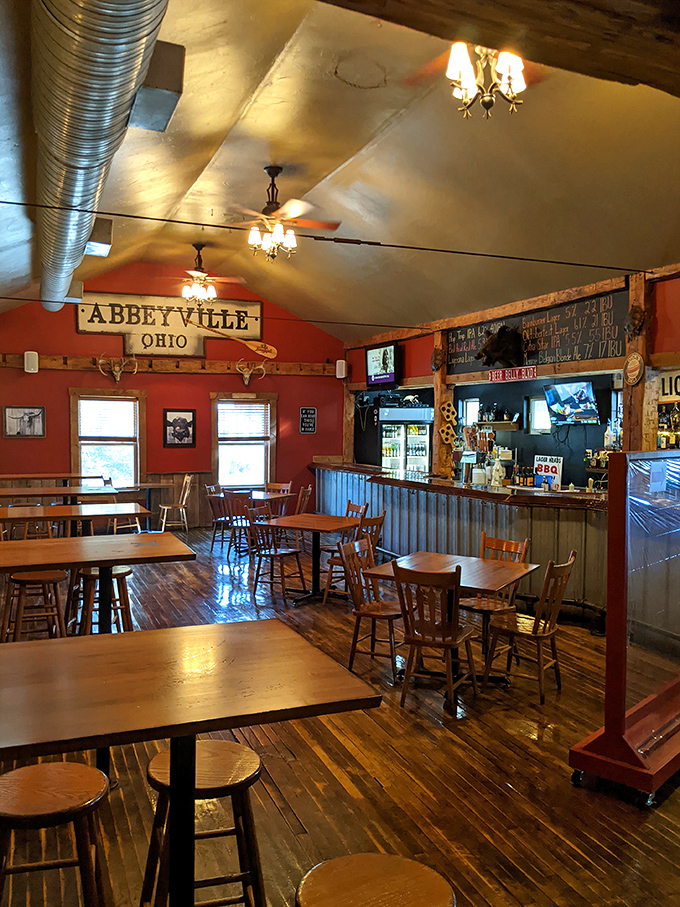 Empty tables that won't stay that way for long. The polished wood and red walls create the perfect backdrop for meat-induced happiness.