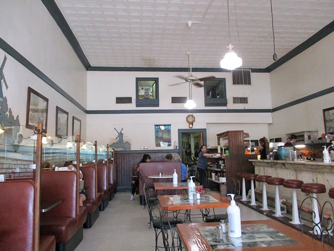 The dining area feels like a community living room where strangers become neighbors over shared appreciation of home cooking and bottomless coffee cups.