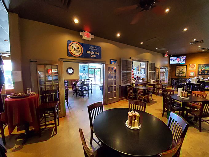 The dining room balances casual comfort with barbecue seriousness&mdash;note the "Best of" banner proudly displayed above the doorway.