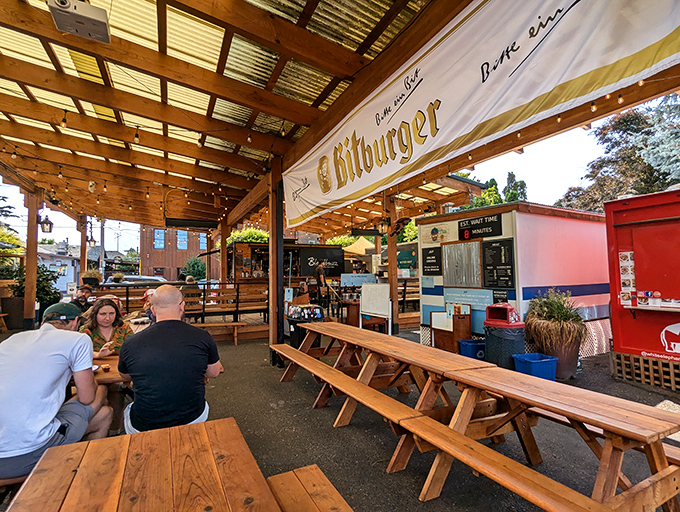 The covered patio at Matt's transforms a simple food cart into a community gathering spot where strangers become friends over shared brisket euphoria.