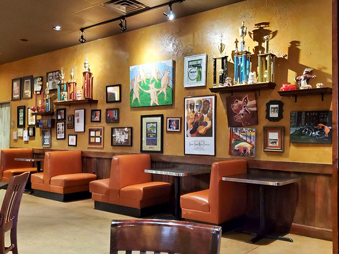 Orange booths against golden walls create a warm backdrop for the real stars&mdash;the plates of barbecue that will soon grace these tables.