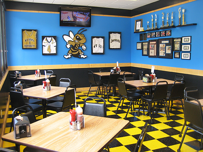 West Virginia sports memorabilia watches over diners like guardian angels of good taste. The blue and yellow decor isn't just school spirit&mdash;it's BBQ spirit.