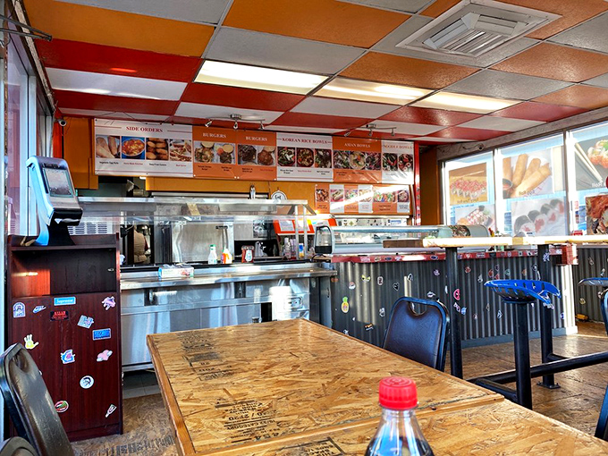The dining area's colorful ceiling tiles and corrugated metal walls create an unpretentious atmosphere where the food, not the decor, takes center stage.
