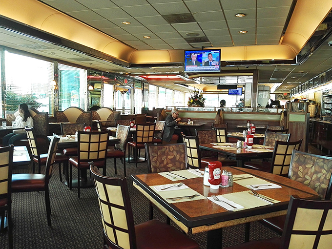The dining area balances retro charm with modern comfort, creating the perfect backdrop for the parade of comfort food classics that emerge from the kitchen.
