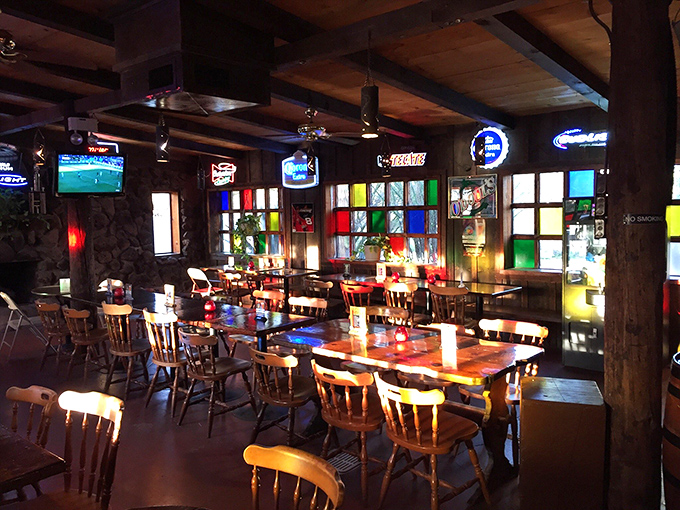 Colorful stained glass windows transform an ordinary dining room into a cathedral of comfort food, with wooden beams blessing every bite.