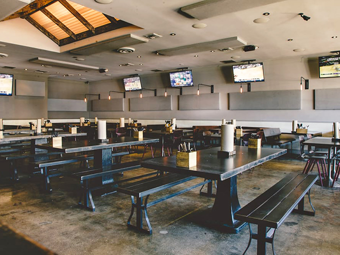 The communal tables aren't just practical&mdash;they're philosophical. Nothing brings strangers together faster than the shared experience of exceptional barbecue.