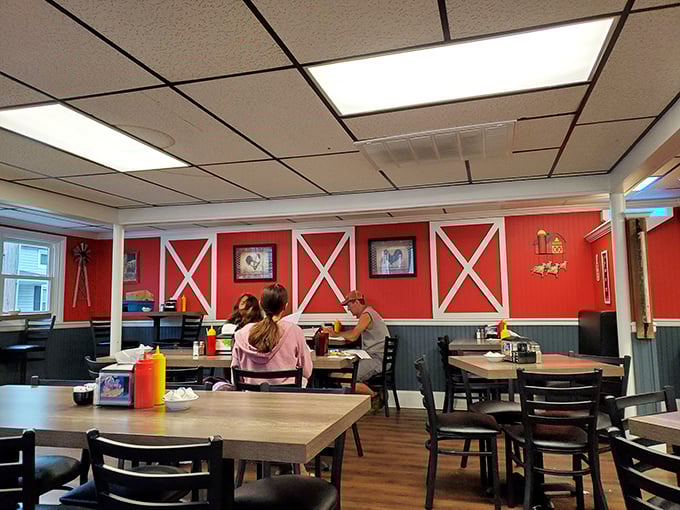 The barn-inspired dining room with its bright red walls says "yes, you're in farm country" without hitting you over the head with a pitchfork of kitsch.