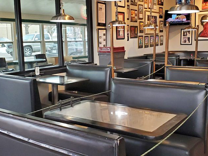 Black booths worn smooth by decades of diners, where the ghosts of late-night conversations linger between bites of Denver omelettes.