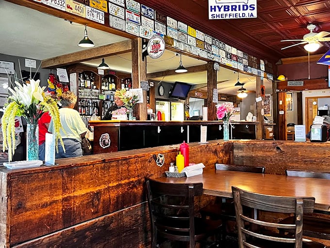 License plates and memorabilia line the walls above rustic wooden booths, telling stories of travelers who've made the burger pilgrimage.