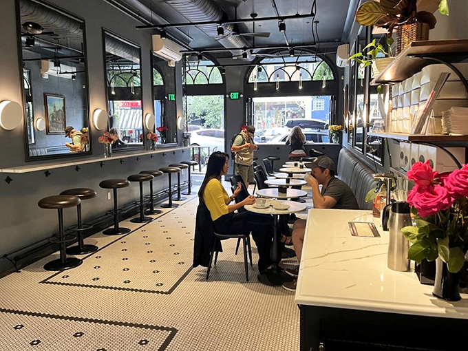 The light-filled dining area invites lingering conversations and "just one more bite" decisions that stretch coffee dates into delightful afternoon affairs.