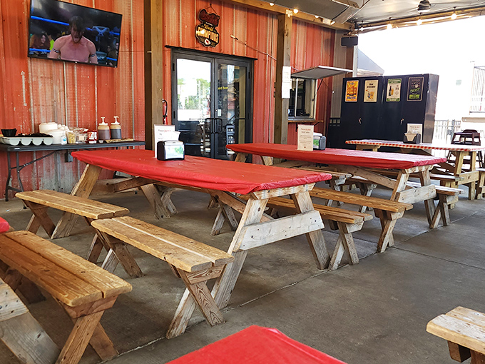 Picnic tables with bright red covers&mdash;where strangers become friends united by the universal language of "mmmmm."