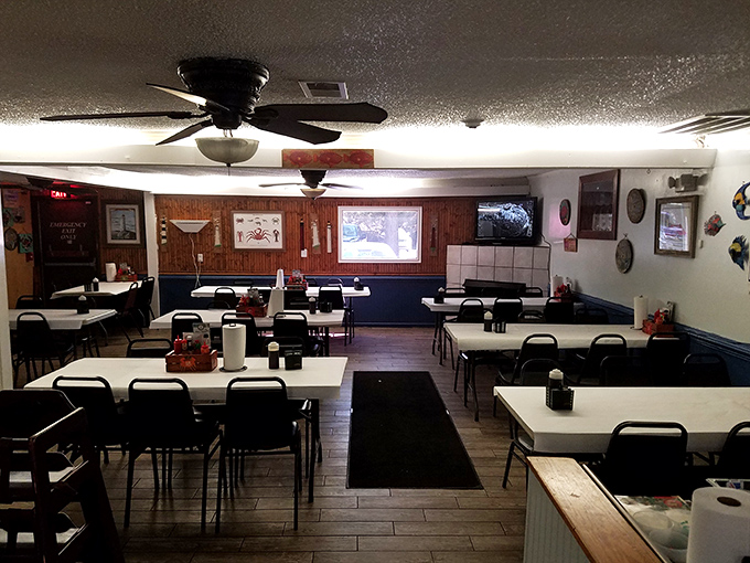 No-frills dining room where the only thing that matters is what's on your plate. Ceiling fans keep the conversation flowing as freely as the seafood.