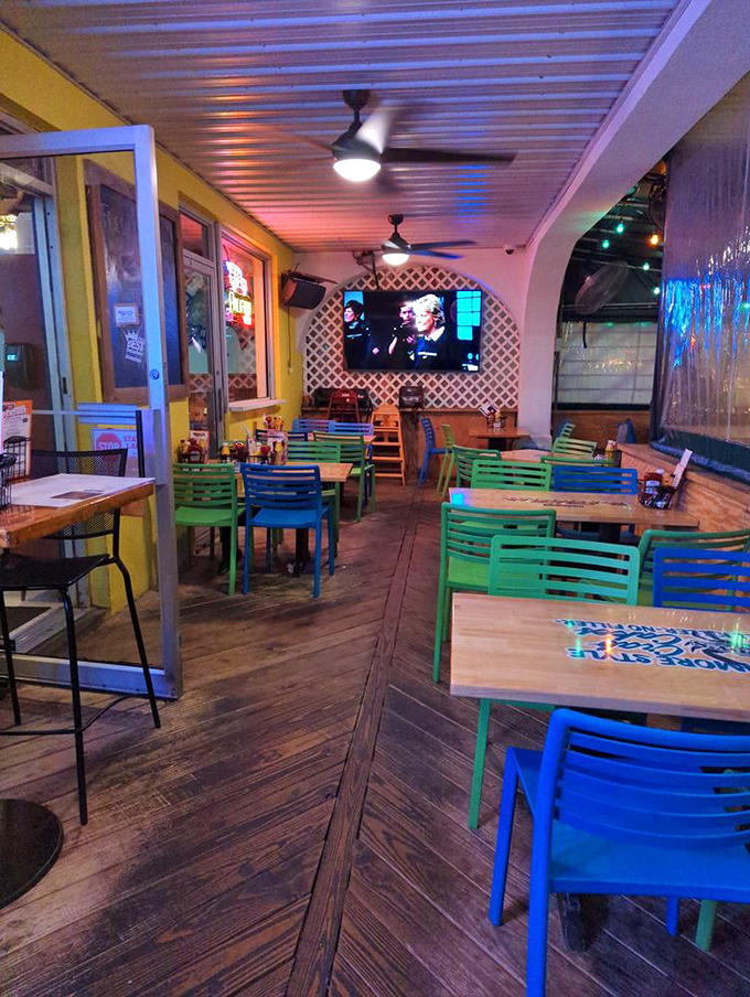 Colorful chairs brighten the dining area like a beach party waiting to happen. Even the furniture knows you're on vacation.