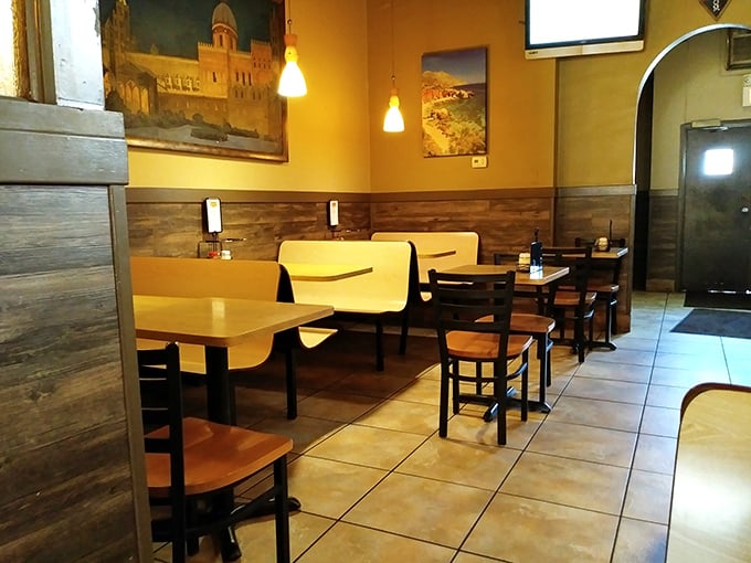 The dining area feels like it's been here forever, with Italian landscapes on the walls reminding you of pizza's noble heritage.