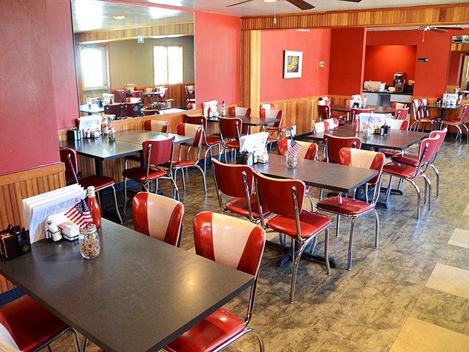 Classic American diner seating that practically assigns you a regular's status upon entry. Those red chairs have cradled more happy diners than a Thanksgiving table.