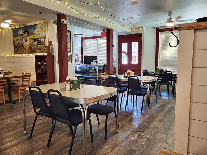 String lights add a touch of warmth to the no-nonsense dining room where generations have gathered for meals that matter.