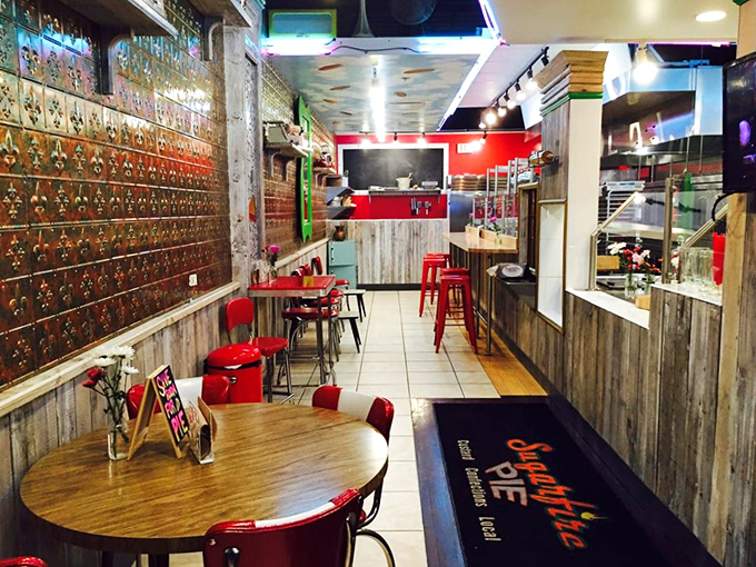 The tin ceiling and colorful accents create a space that feels both nostalgic and fresh, like your favorite song remixed by someone who actually gets it.