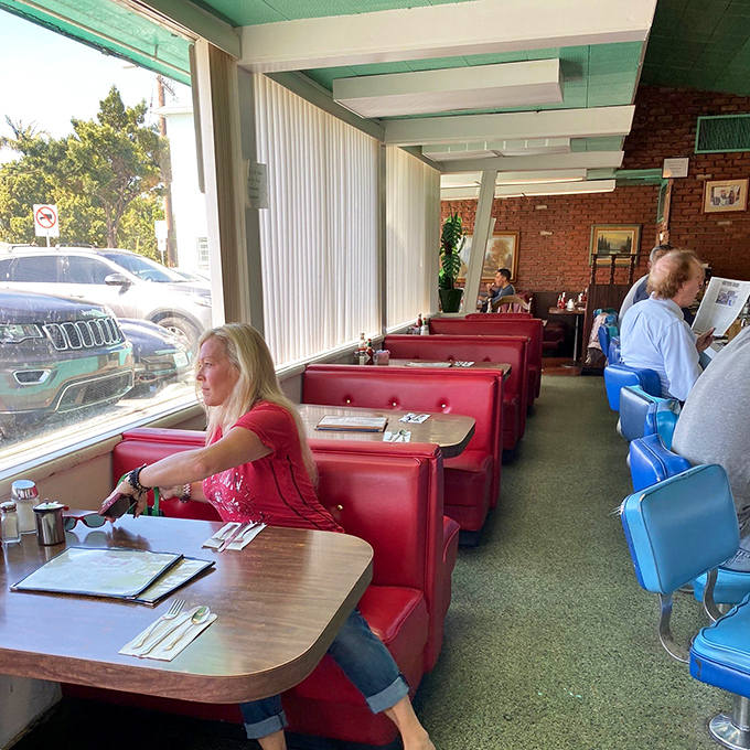 Red vinyl booths and turquoise accents &ndash; where strangers become neighbors and everyone's connected by the universal language of "pass the syrup."