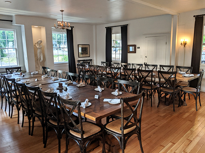 The dining area strikes that perfect balance between "special occasion" and "Tuesday night dinner" with its warm woods and elegant place settings. 