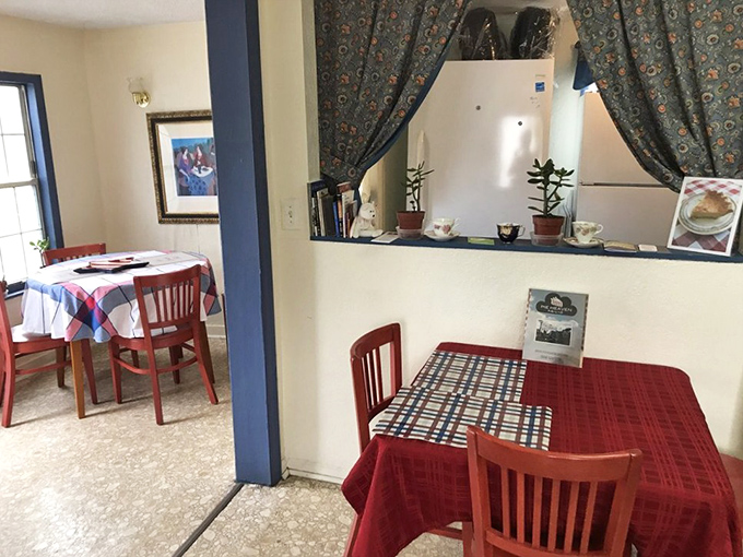 The dining area's simple charm comes from its authenticity&mdash;red tablecloths, mismatched chairs, and the knowledge that you're about to experience something extraordinary in ordinary surroundings.