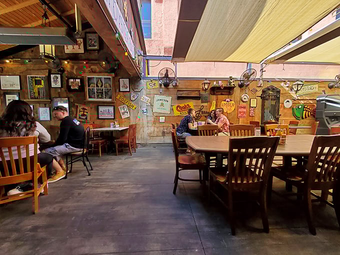 Every table tells a story in this rustic dining room. The well-worn wooden chairs have supported countless happy diners over decades of service.