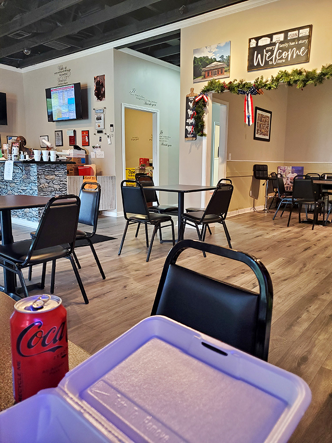 A Coca-Cola can and an empty table&mdash;the calm before the storm of flavors about to hit your taste buds.