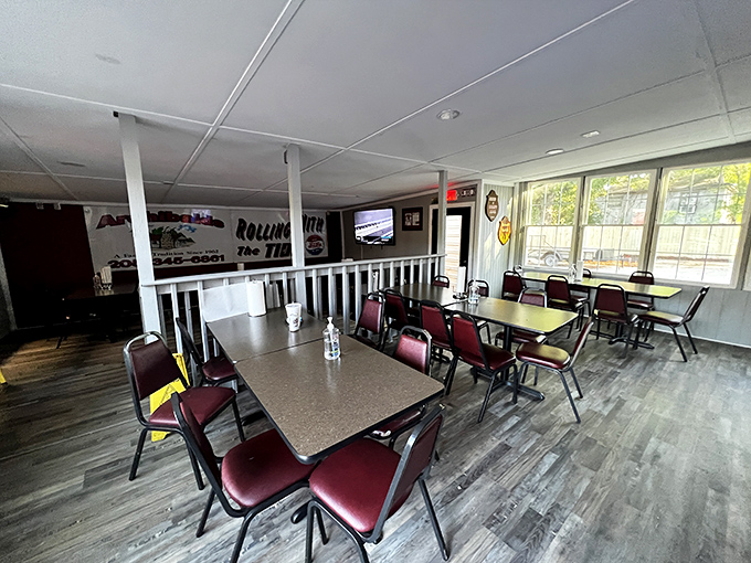 Crimson chairs and wood-panel walls create the perfect stage for BBQ drama to unfold. Simplicity in service of spectacular eating.