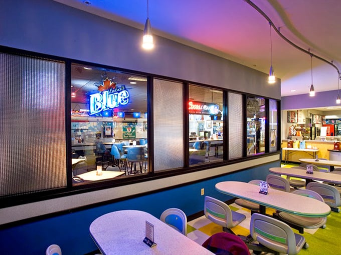 The dining area's blue walls and pendant lighting create the perfect atmosphere for that post-strike celebration meal or gutter-ball consolation feast.