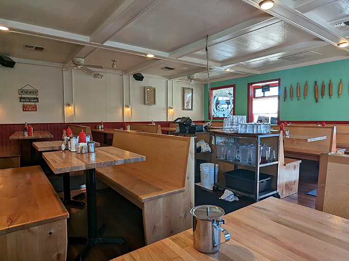 The dining room feels like it was designed by someone who understands that breakfast deserves proper wooden booths and just the right lighting.