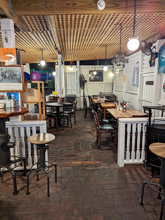 The dining room feels like eating in a beloved old boat&mdash;wooden lattice ceiling, brick floors, and white railings creating an atmosphere that says "relax, you've arrived."
