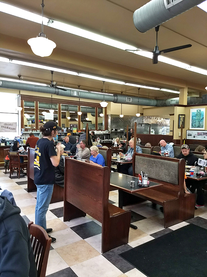 The dining area hums with the symphony of forks against plates and conversations that matter, all under the watchful gaze of ceiling fans that have seen it all.