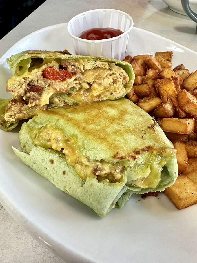 This burrito didn't come to play—it came to slay. Wrapped in a vibrant green tortilla, it's breakfast's answer to superhero origin stories.