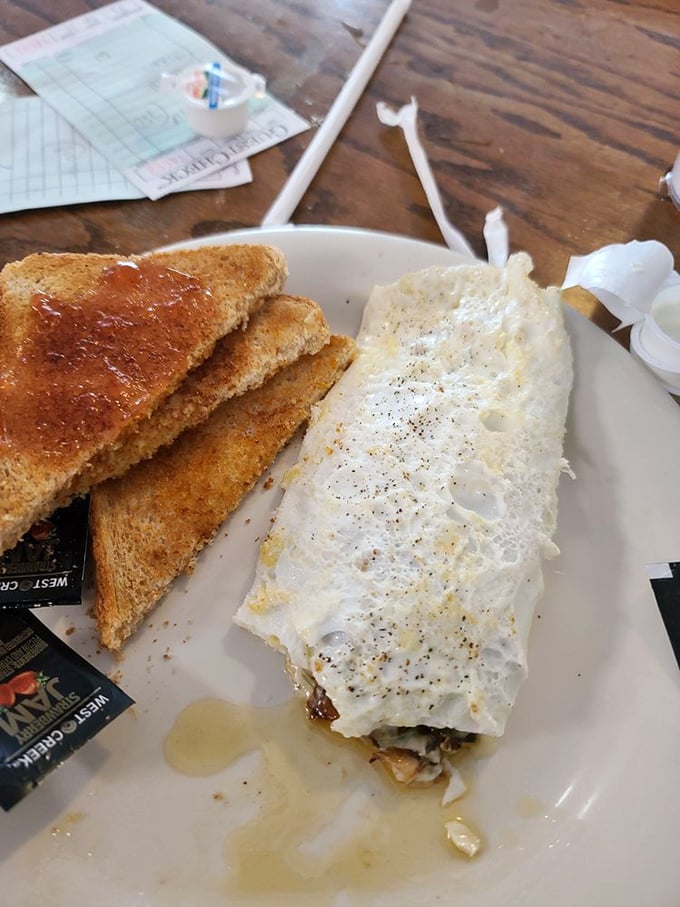 The egg white omelet that refuses to sacrifice flavor for virtue. Those veggies and toast make healthy eating feel like cheating.