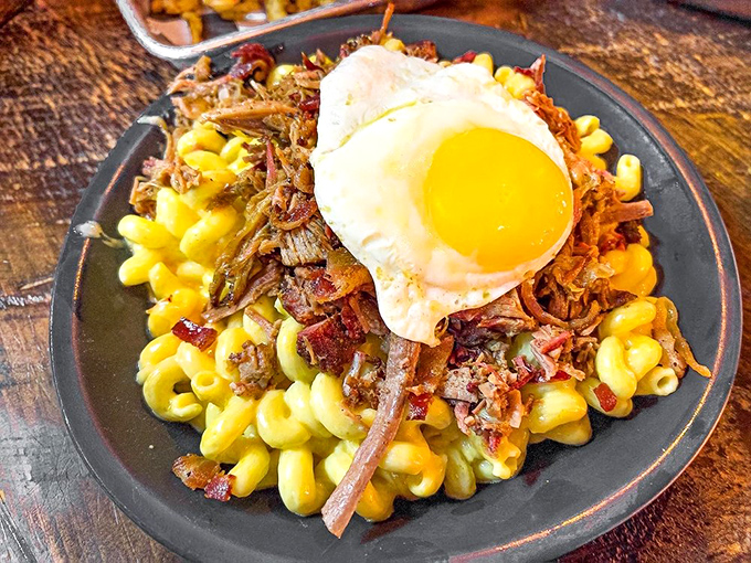 Mac & cheese crowned with brisket and a sunny-side egg&mdash;because sometimes regular comfort food just isn't comforting enough. This is therapy on a plate.