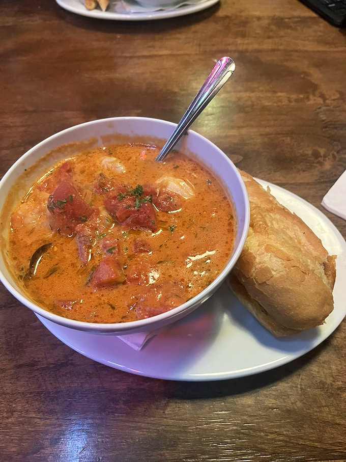 A bowl of seafood stew that could make Neptune himself swim to shore. Warm, rich, and ready to comfort your soul.