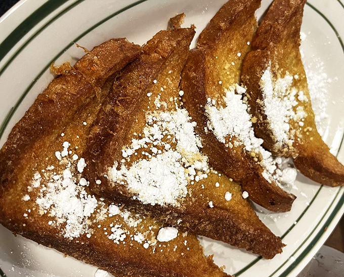 French toast that makes regular toast look like it's not even trying. Dusted with powdered sugar like a light Arkansas snowfall on breakfast paradise.