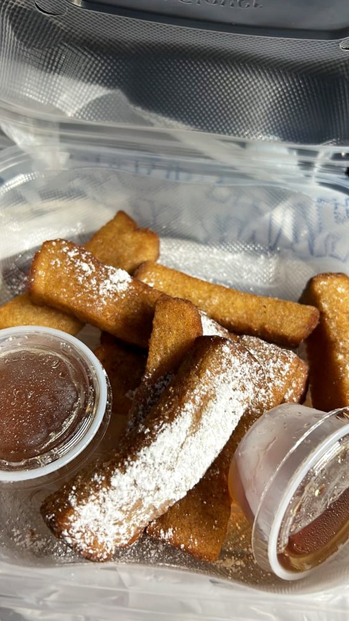French toast sticks: breakfast reimagined as finger food. The powdered sugar isn't decoration&mdash;it's essential infrastructure for the dipping sauces.