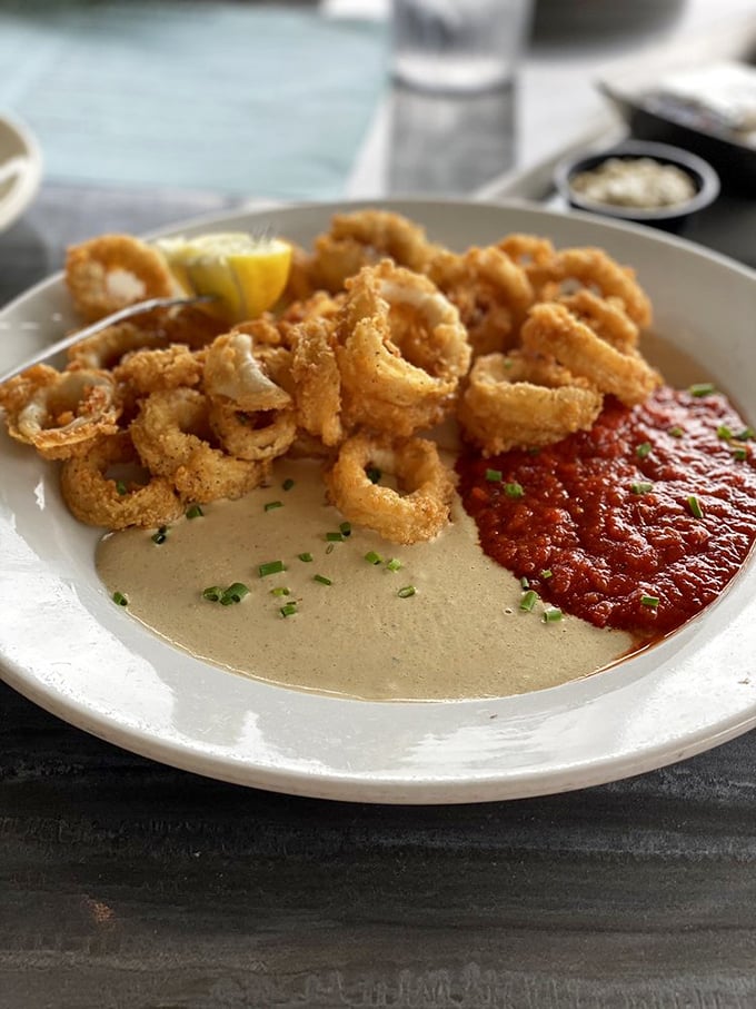 Calamari so perfectly fried it makes you wonder why anyone bothers with onion rings. Two dipping sauces because life's too short for monogamy.