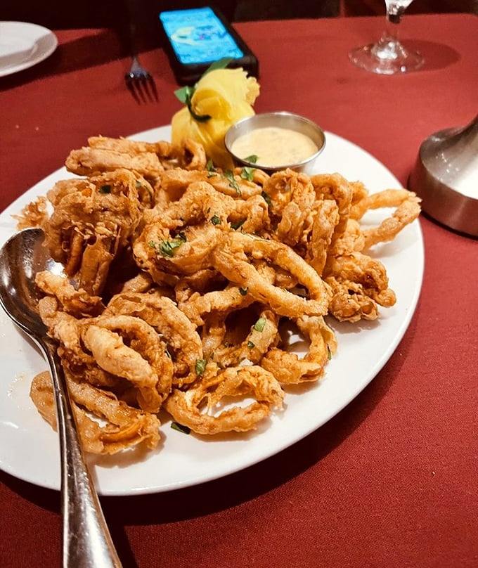 Calamari so perfectly crisp it makes other fried foods jealous. Each golden ring deserves its own tiny Olympic medal for excellence.
