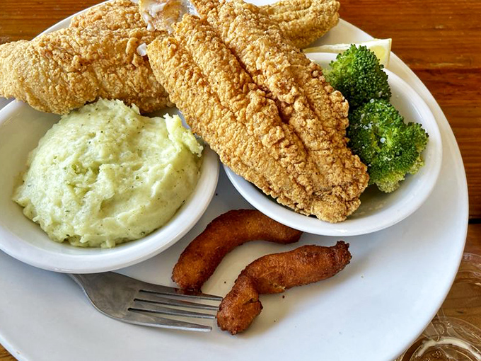 Southern comfort meets seafood tradition. This golden-battered catfish with crispy sides is the landlocked state's answer to fish and chips.