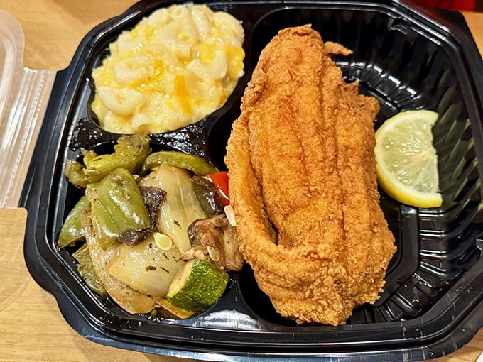 Cornmeal-crusted catfish with a side of vegetables and mac and cheese&mdash;the Southern trifecta that makes diets weep with jealousy.