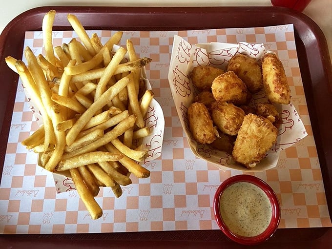 Wisconsin's unofficial state food meets French culinary tradition. These golden cheese curds and fries are what vacation calories were invented for.