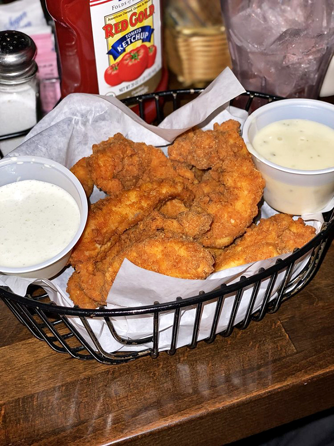 Fried chicken strips that remind you why sometimes the simplest foods, executed perfectly, can bring more joy than any molecular gastronomy.