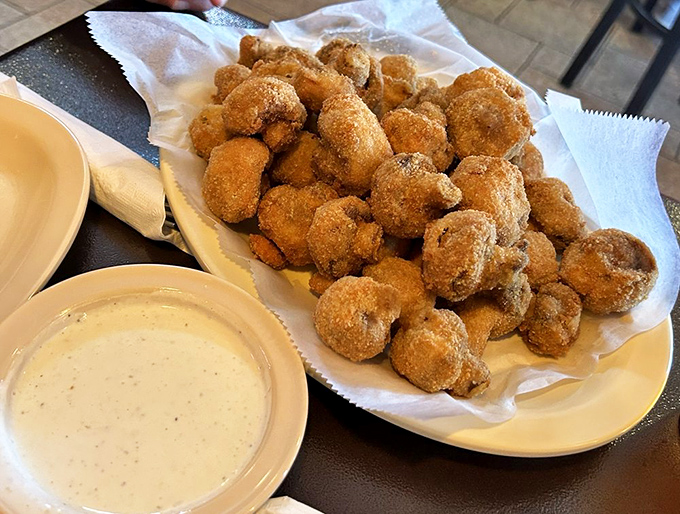 These golden-brown mushrooms aren't just appetizers, they're little umami bombs waiting to detonate deliciousness across your taste buds.