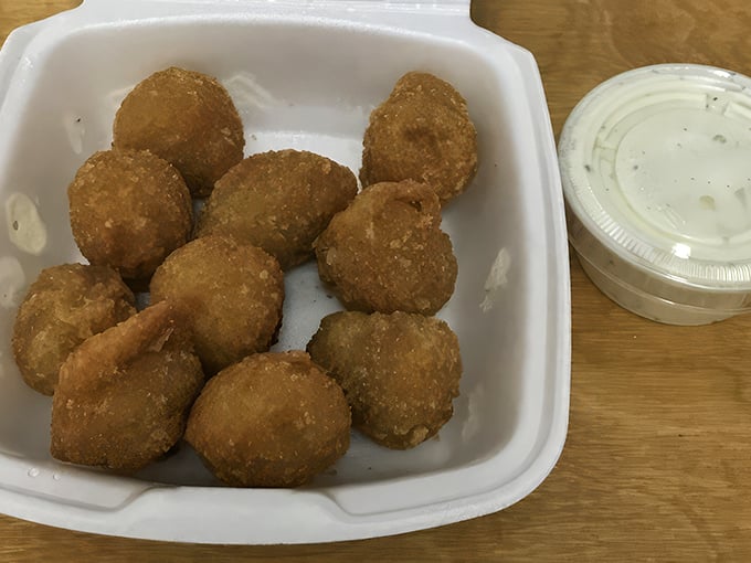 Fried mushrooms: the unsung heroes of the appetizer world, golden-brown ambassadors of umami in their foam throne.