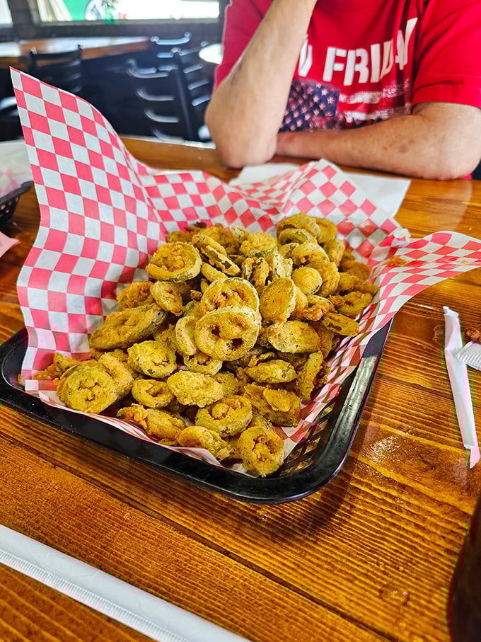 Fried pickles: proof that Southern ingenuity knows no bounds. Tangy, crunchy circles of joy that disappear faster than you can say "Pass the ranch."
