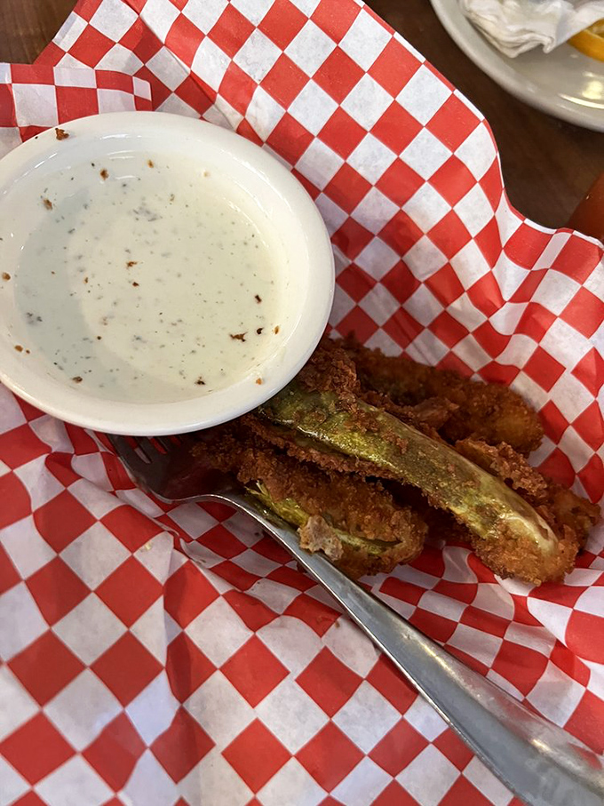 Fried pickles: proof that anything becomes magical when battered and introduced to hot oil. The ranch dip is just the supporting actor.